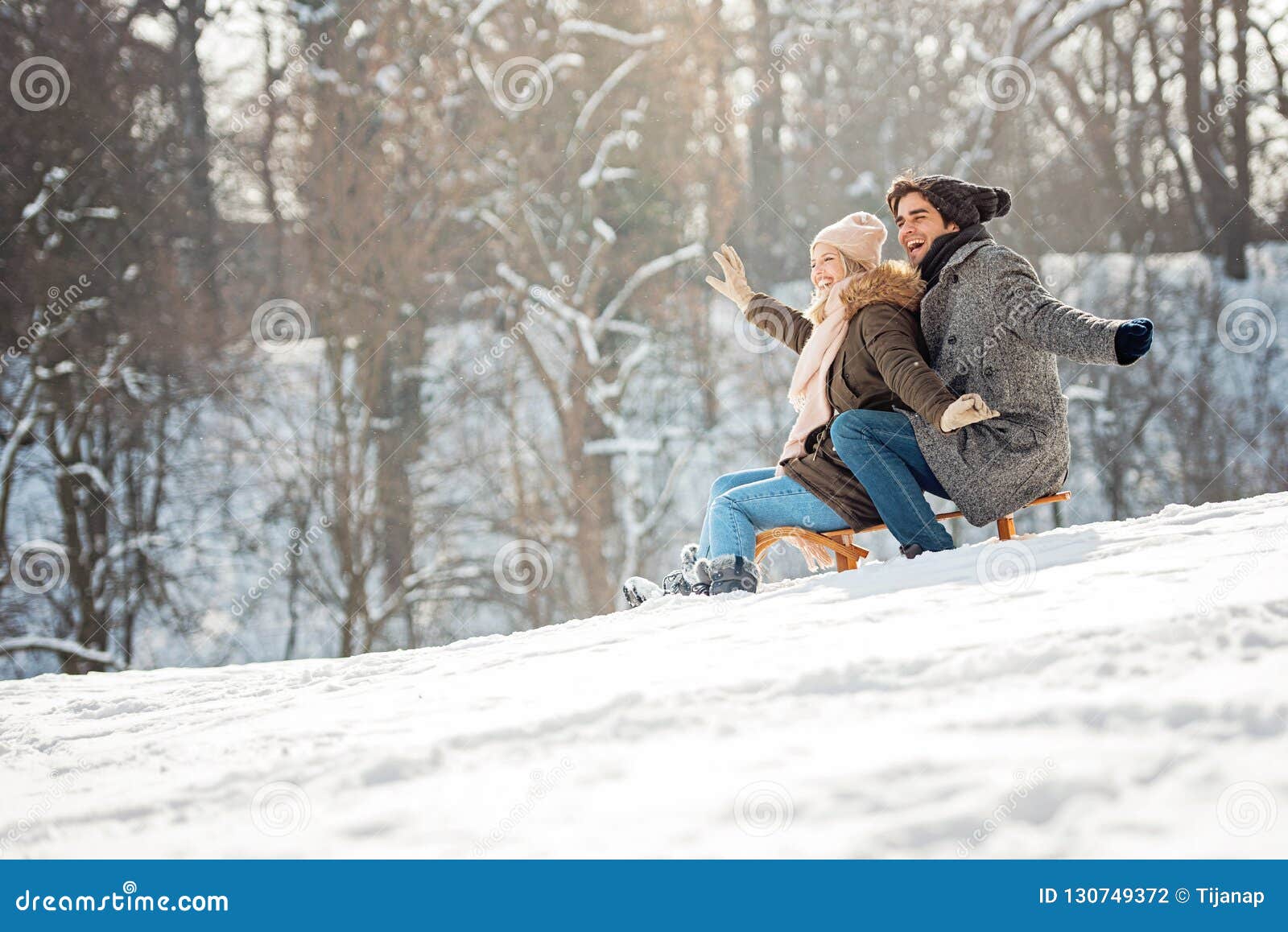 Two Young People Sliding on a Sled Stock Photo - Image of sleigh ...