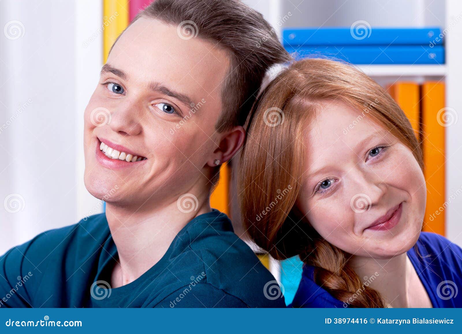Two young people smiling stock photo. Image of highschool - 38974416