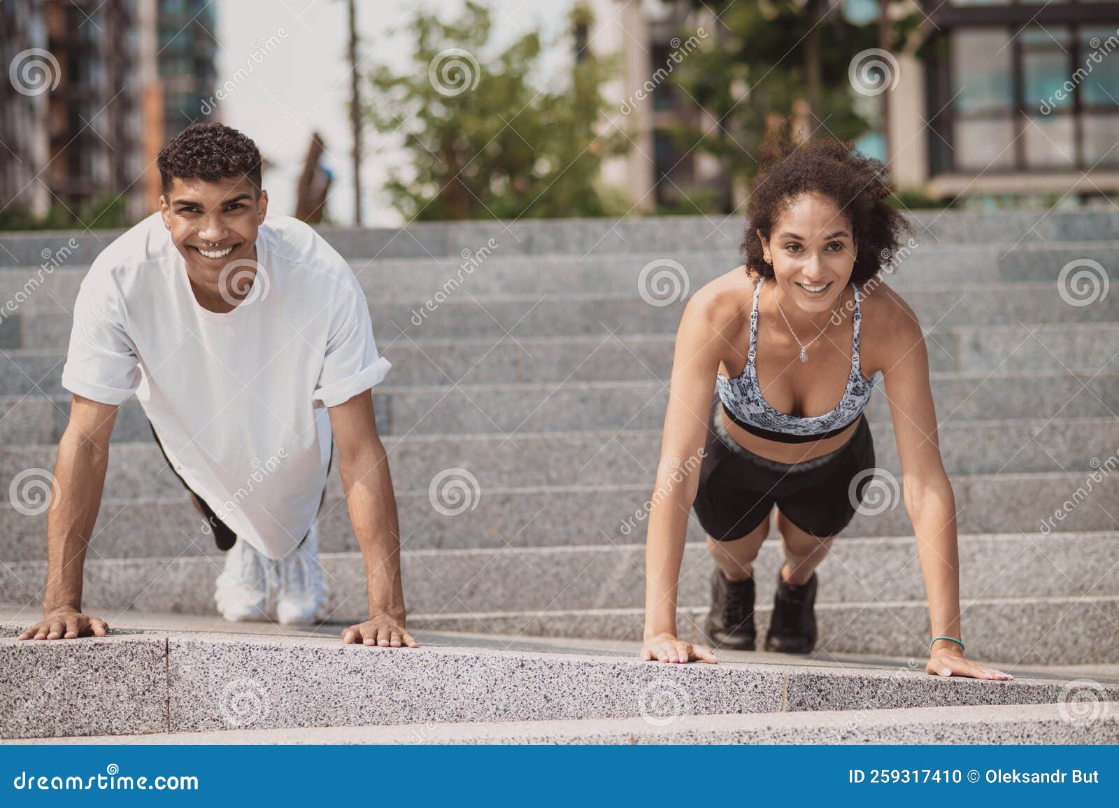 Two Young People Standing in Plank and Smiling Stock Photo - Image of ...
