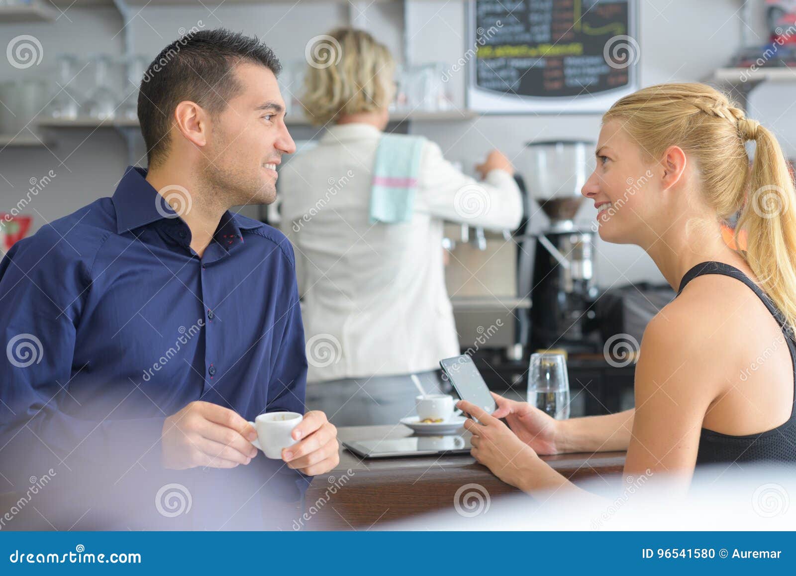 Two Young People Talking in Cafe Stock Photo - Image of people ...