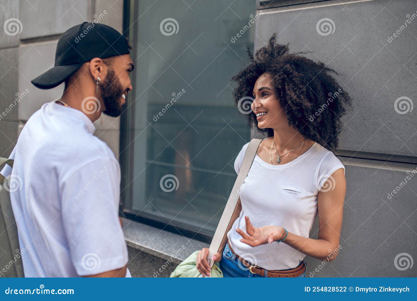 Two Young People Talking and Looking Involved Stock Photo - Image of ...