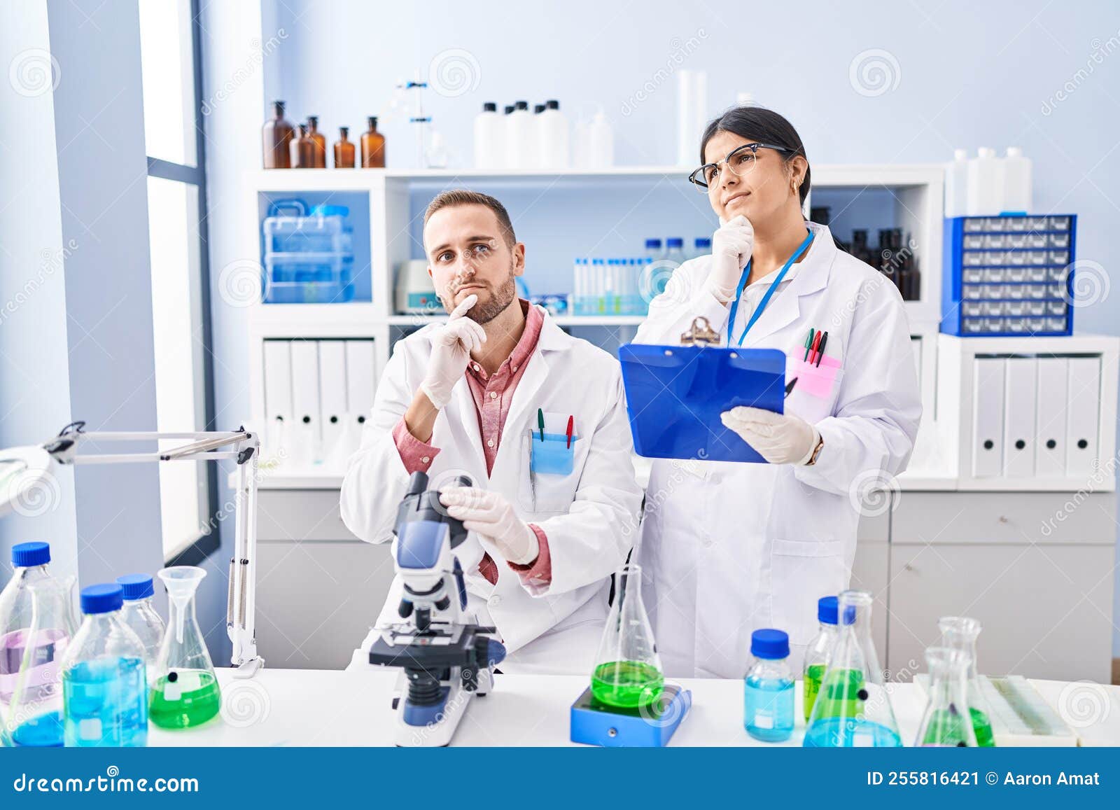Two Young People Working at Scientist Laboratory Serious Face Thinking ...