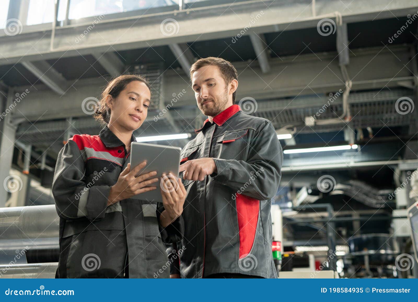 Two Young Quality Control Managers of Polymer Processing Factory Using ...