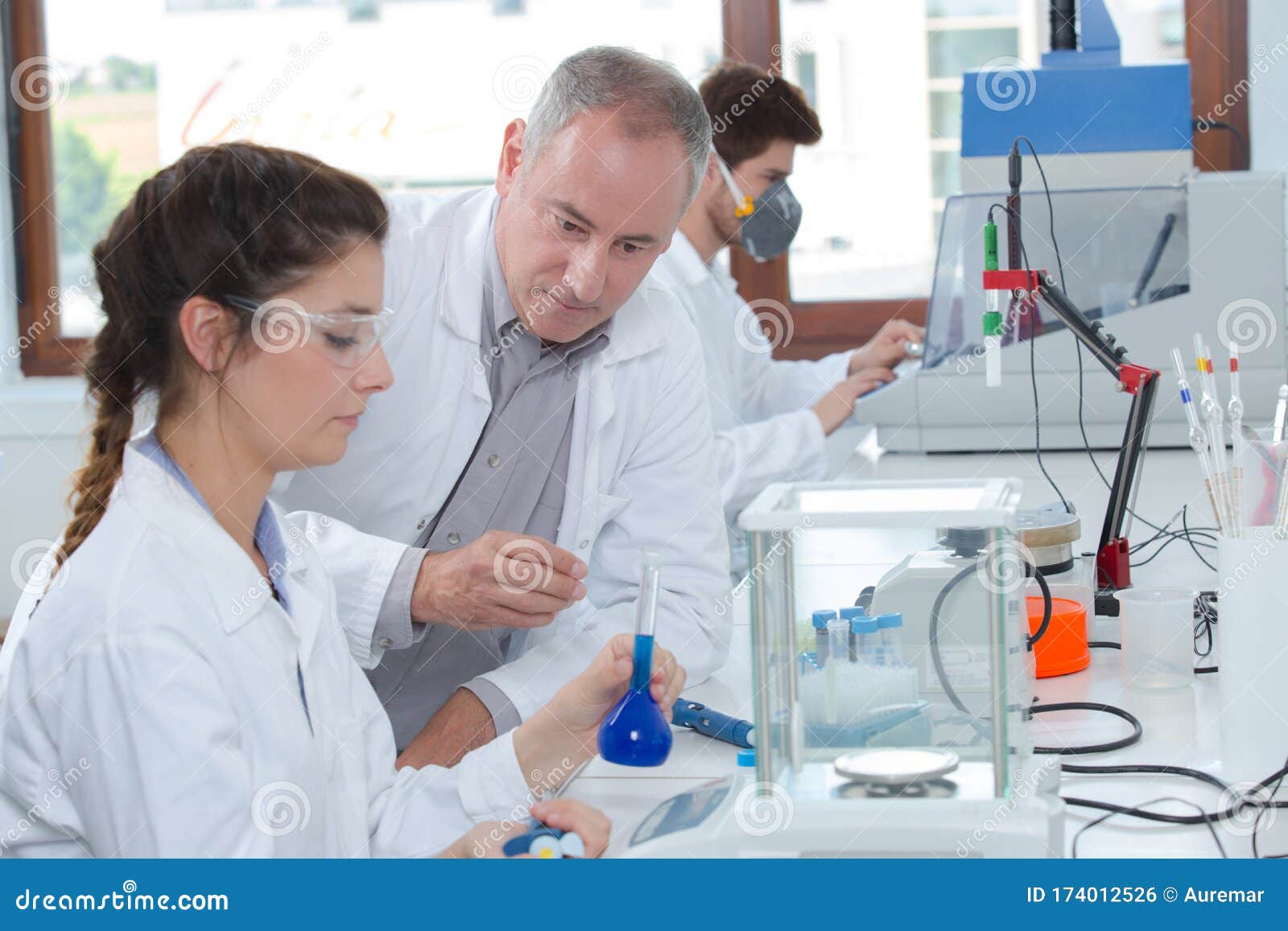 Two Young Researchers Carrying Out Experiments in Lab Stock Photo ...
