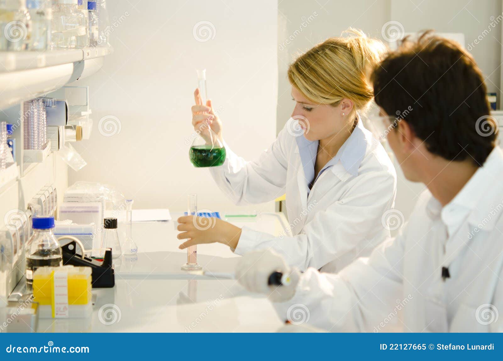 Two Young Researchers at Work Stock Image - Image of blond, experiment ...