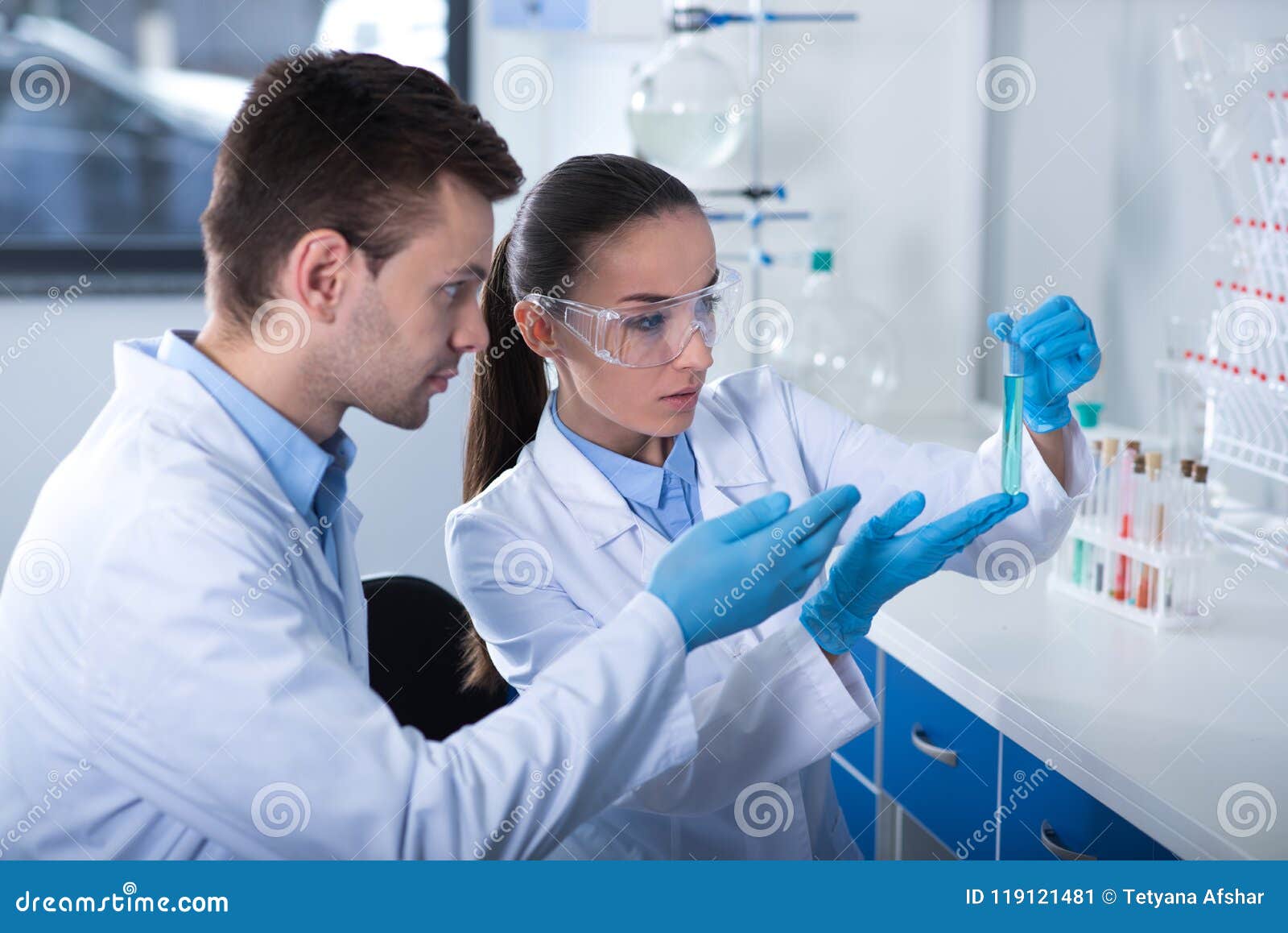 Two Young Scientists Conducting the Research and Concentrating on it ... Two Young Scientists Conducting the Research and Concentrating on it ...