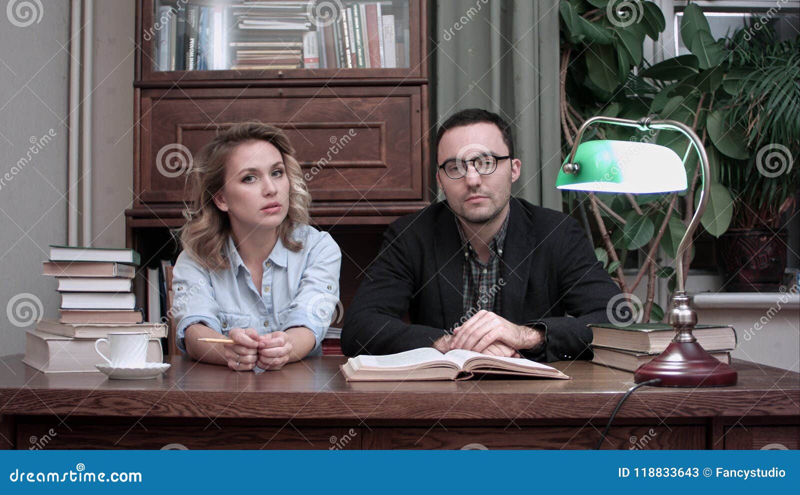 Two Young Scientists Sitting at the Desk Presenting Their Project Stock ...