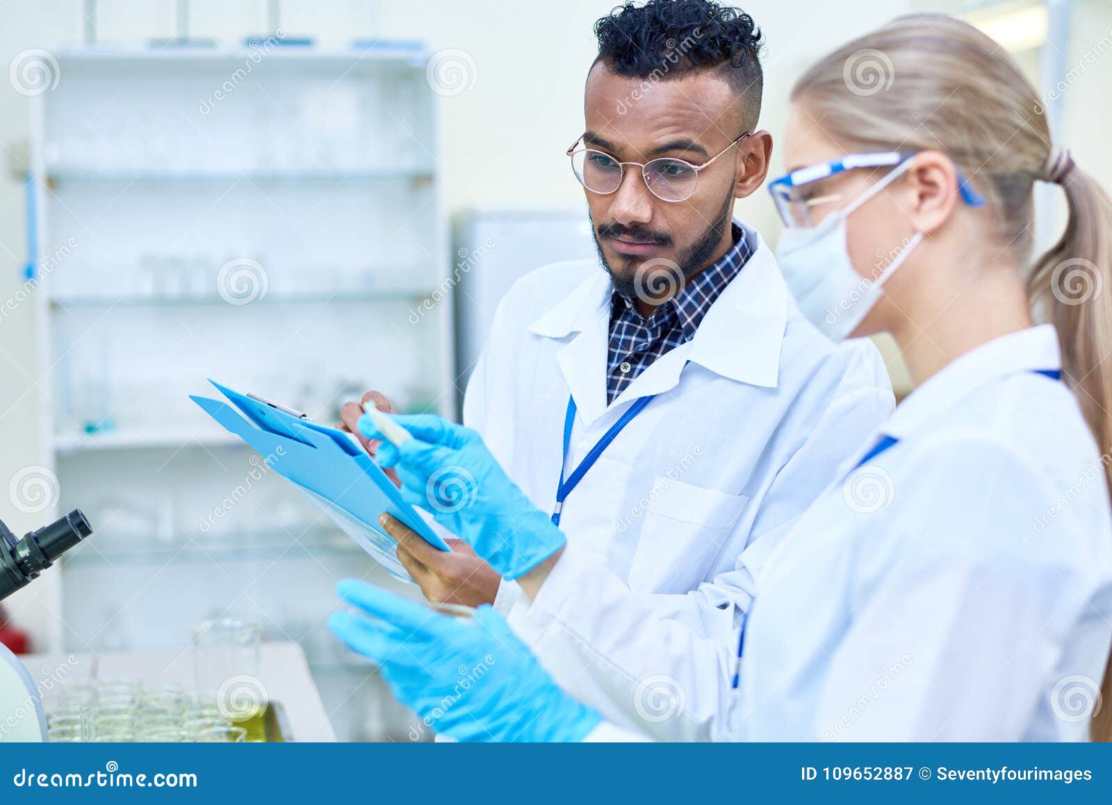 Two Young Scientists Working in Lab Stock Image - Image of occupation ... Two Young Scientists Working in Lab Stock Image - Image of occupation ...