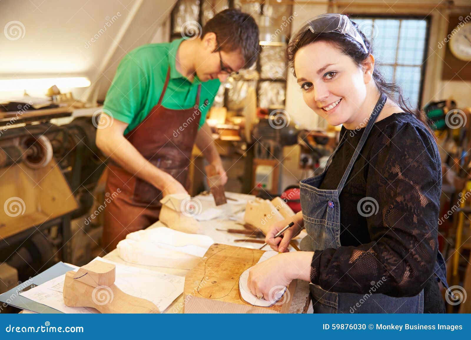 Two Young Shoemakers Preparing Shoe Lasts in a Workshop Stock Photo ...