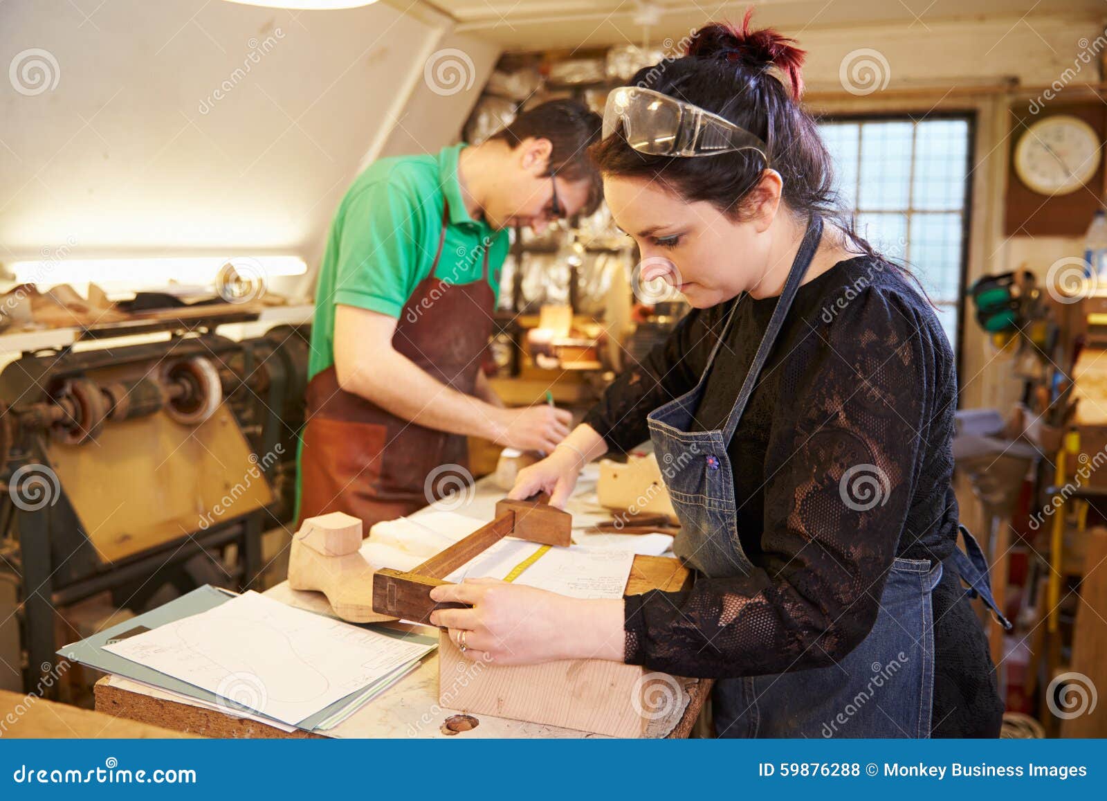 Two Young Shoemakers Preparing Shoe Lasts in a Workshop Stock Photo ...