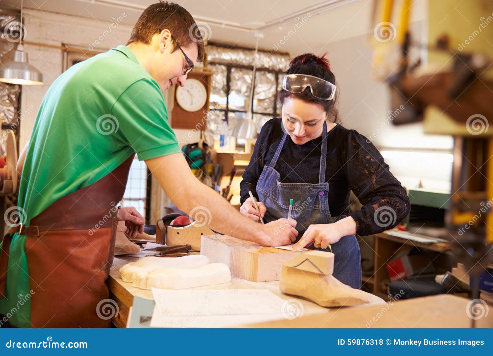 Two Young Shoemakers Preparing Shoe Lasts in a Workshop Stock Photo ...