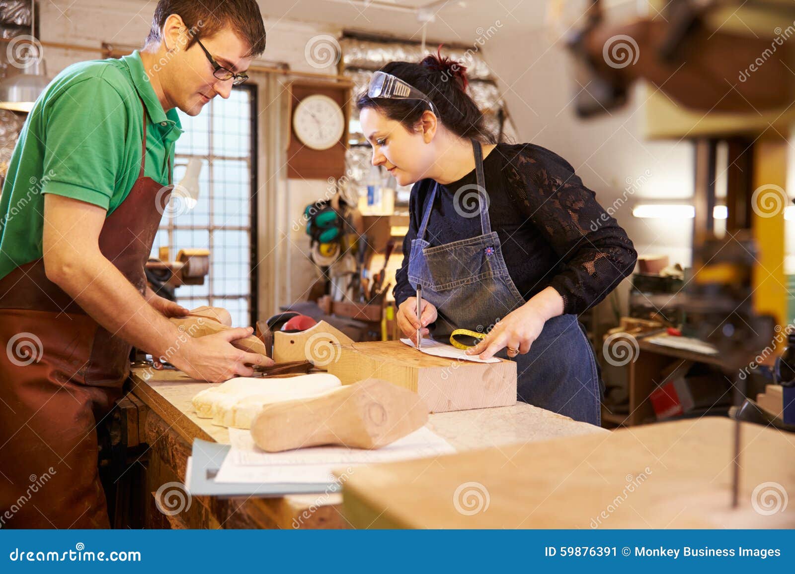 Two Young Shoemakers Preparing Shoe Lasts in a Workshop Stock Image ...