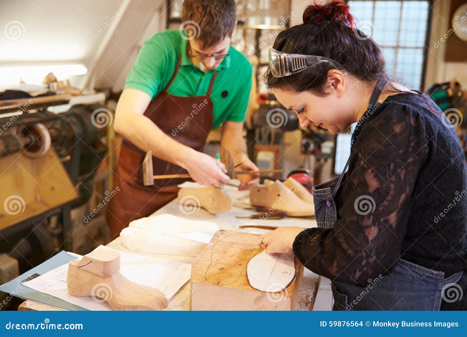 Two Young Shoemakers Preparing Shoe Lasts in a Workshop Stock Photo ...