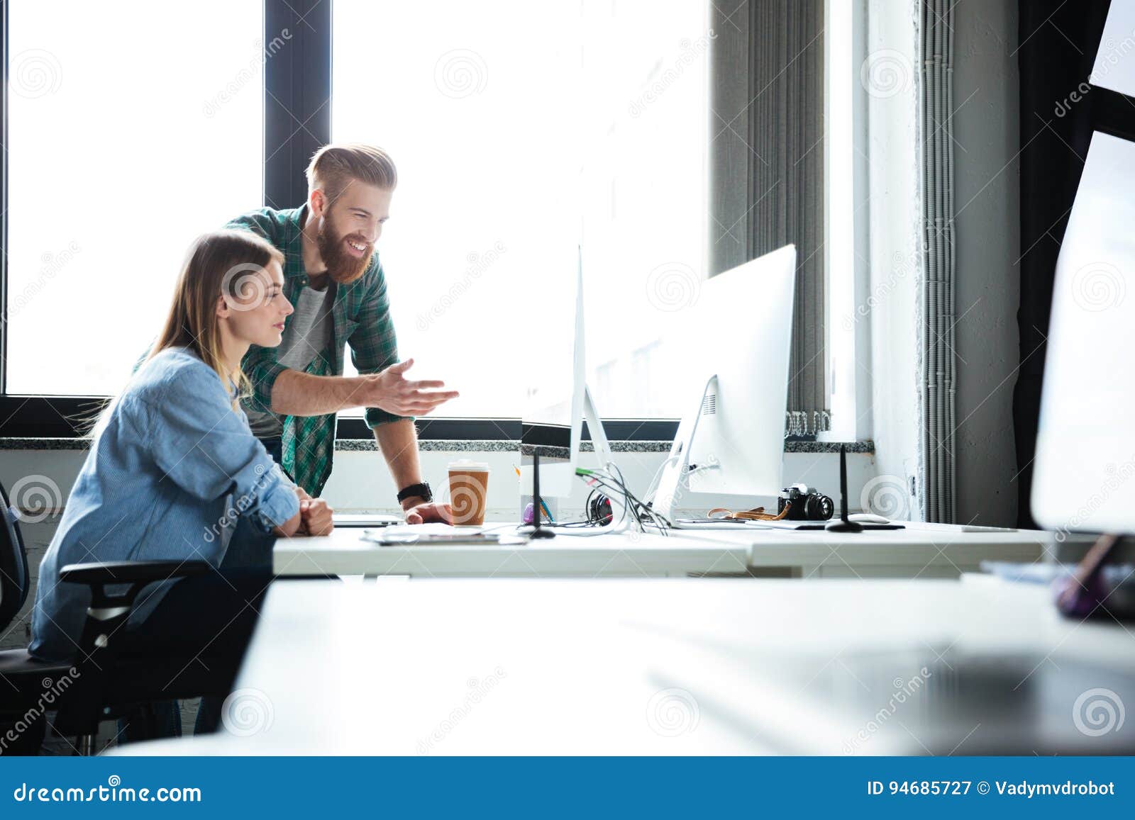 Two Young Smiling Colleagues Work in Office Stock Image - Image of ...