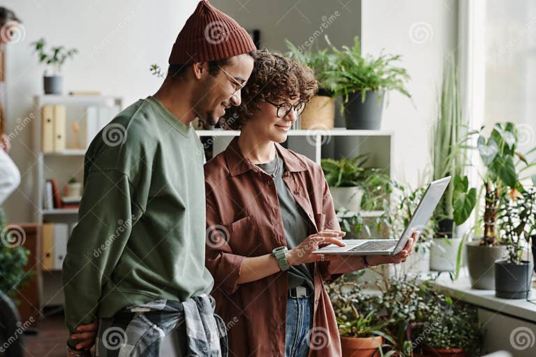 Two Young Software Developers Discussing Online Information Stock Photo - Image of diversity ...