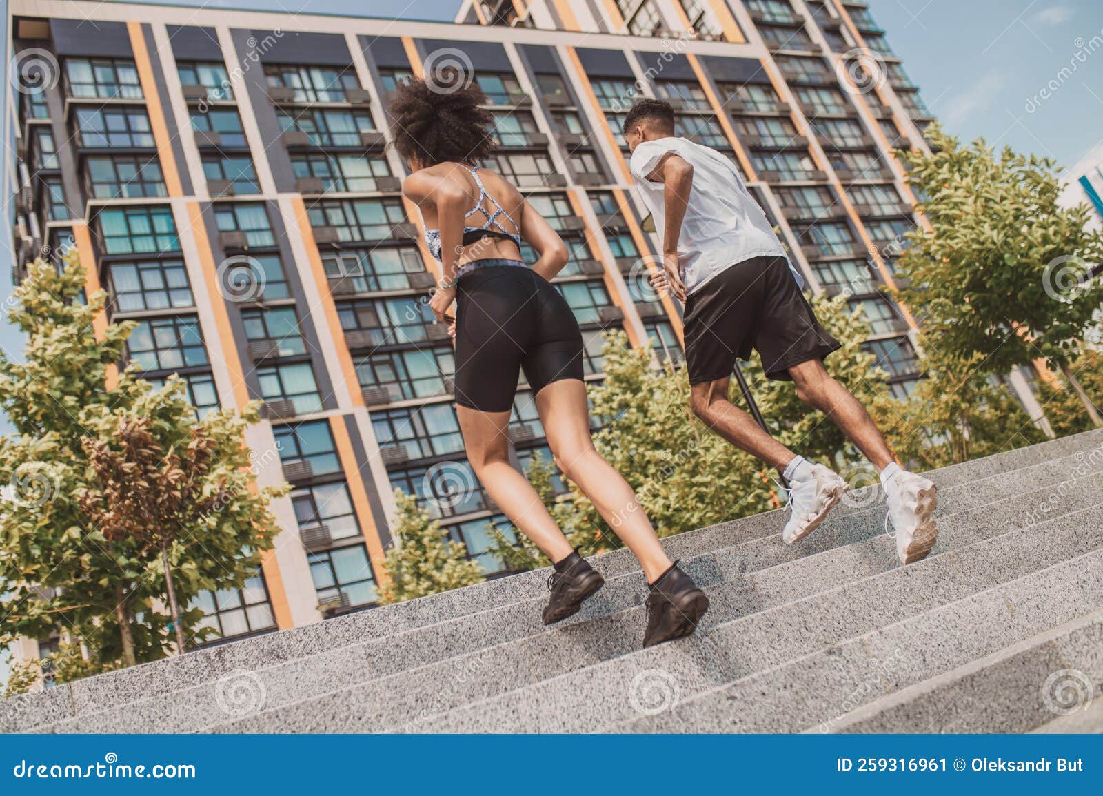 Two Young Sportsmen Running and Looking Energized Stock Image - Image ...