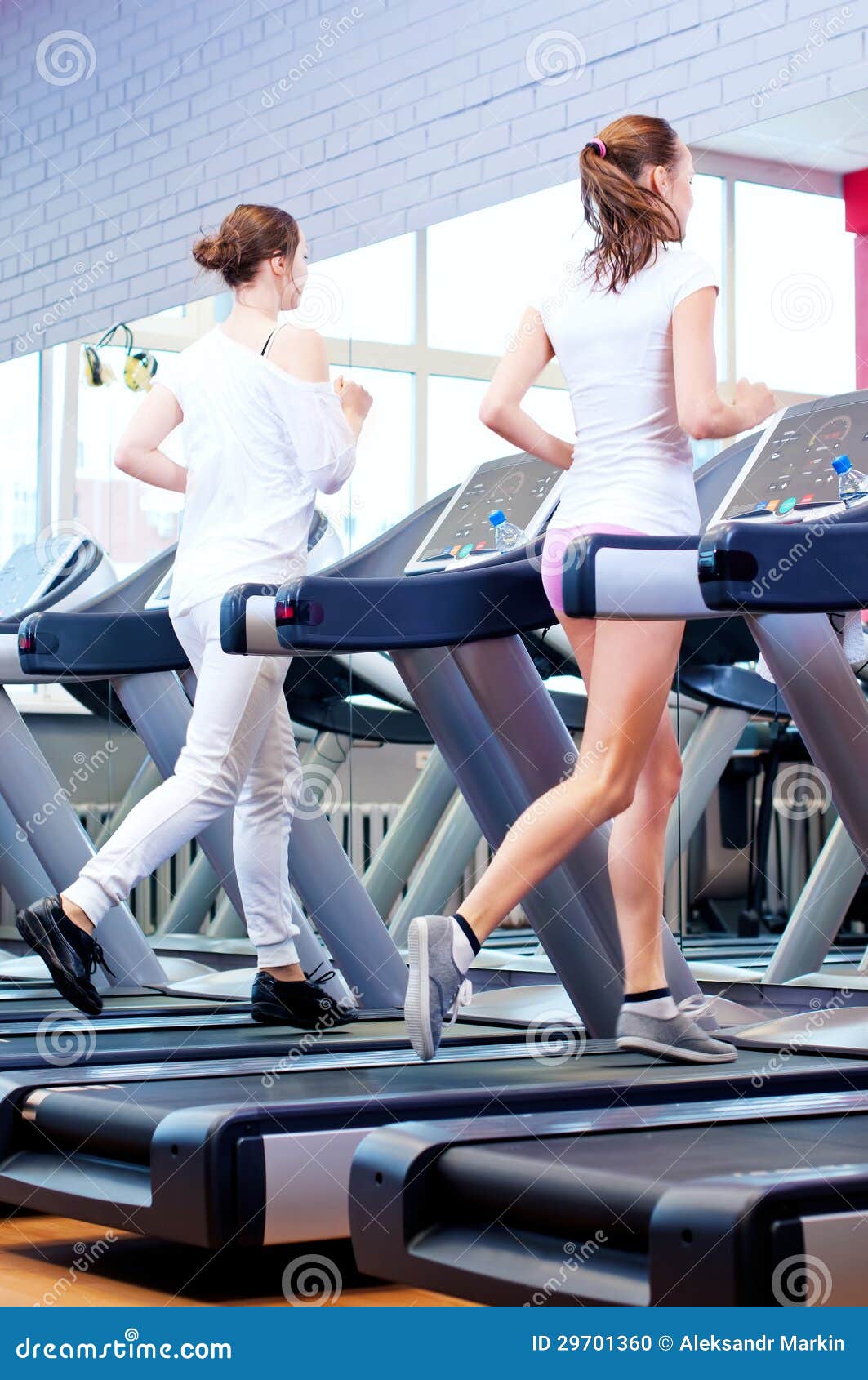 Two Young Sporty Women Run on Machine Stock Photo - Image of class ...