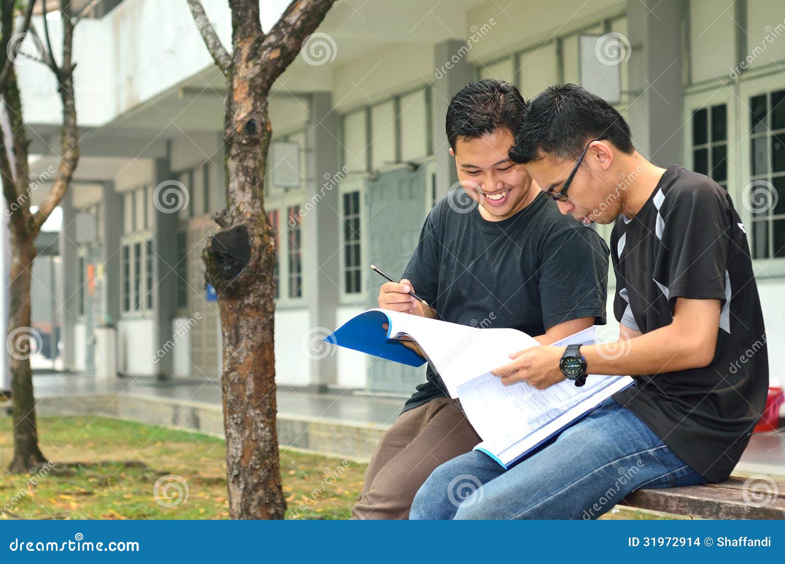 Two Young Student Reading Books Stock Photo - Image of backpack, campus ...