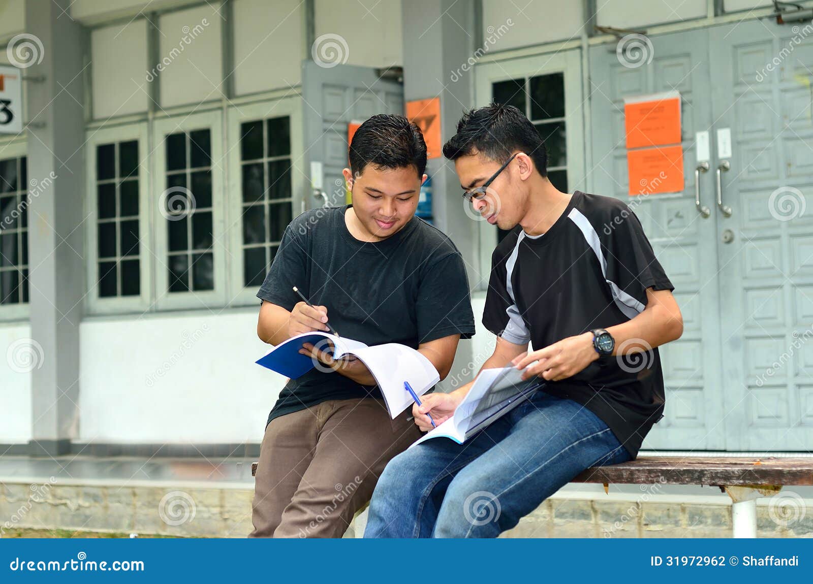 Two Young Student Reading Books Stock Photo - Image of field, person ...