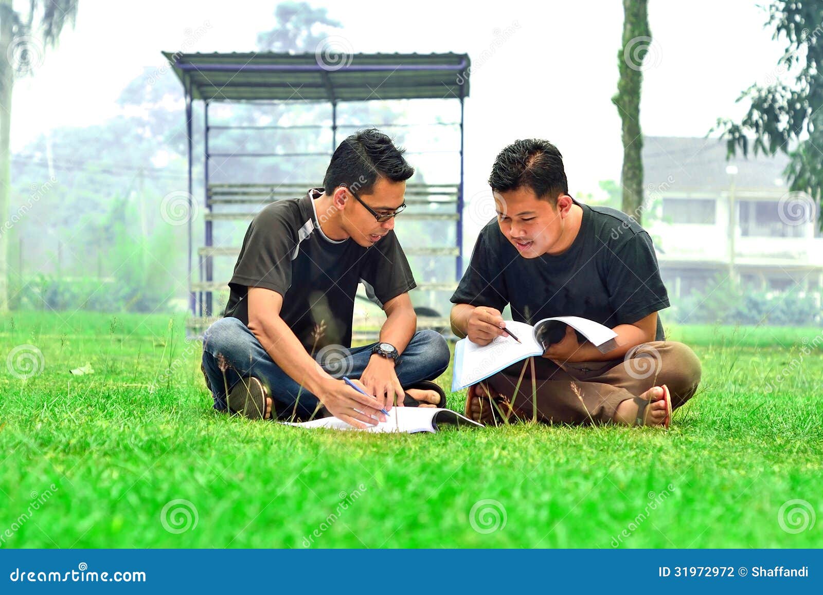 Two Young Student Reading Books Stock Photo - Image of outdoors, park ...
