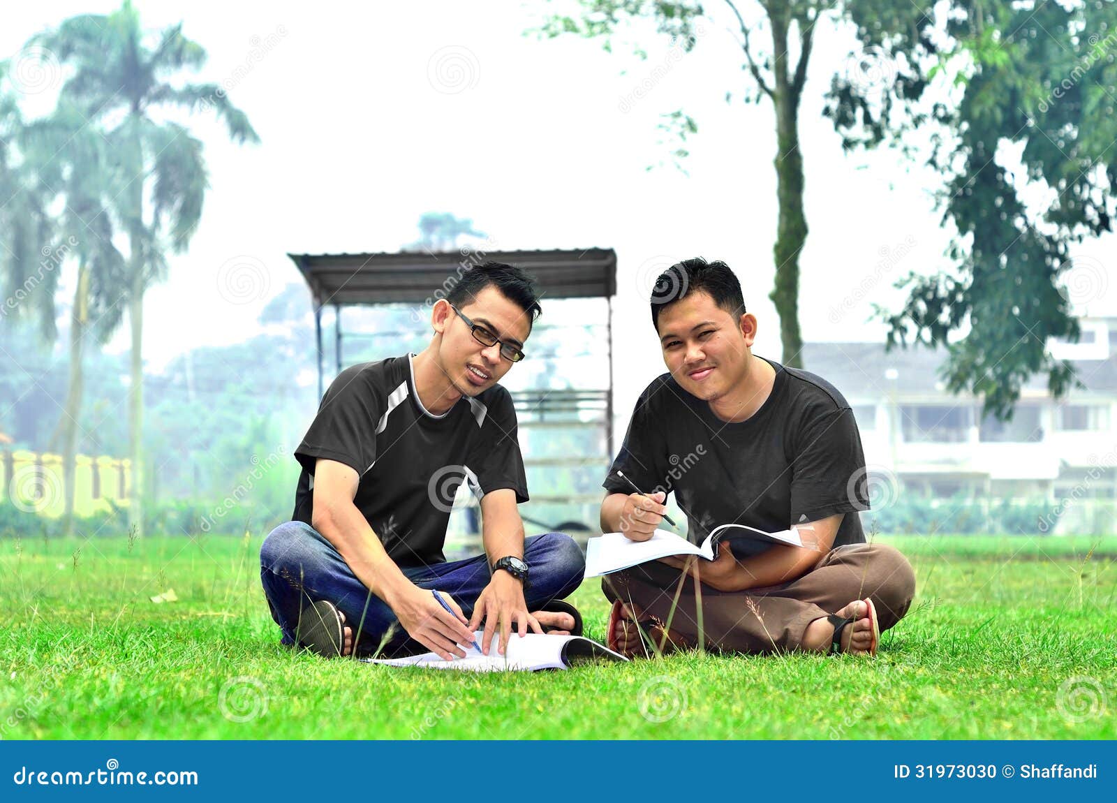Two Young Student Reading Books Stock Photo - Image of learn, grass ...