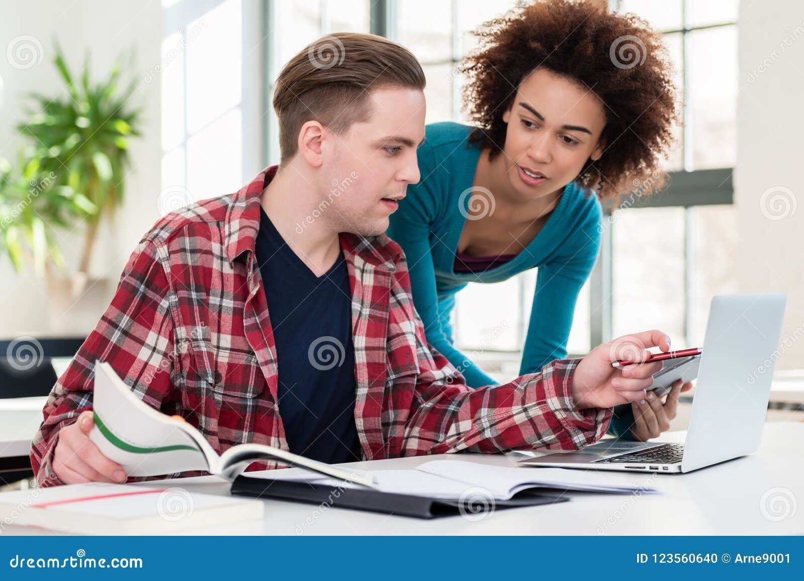 Two Young Students Browsing Internet for Online Useful Information ...