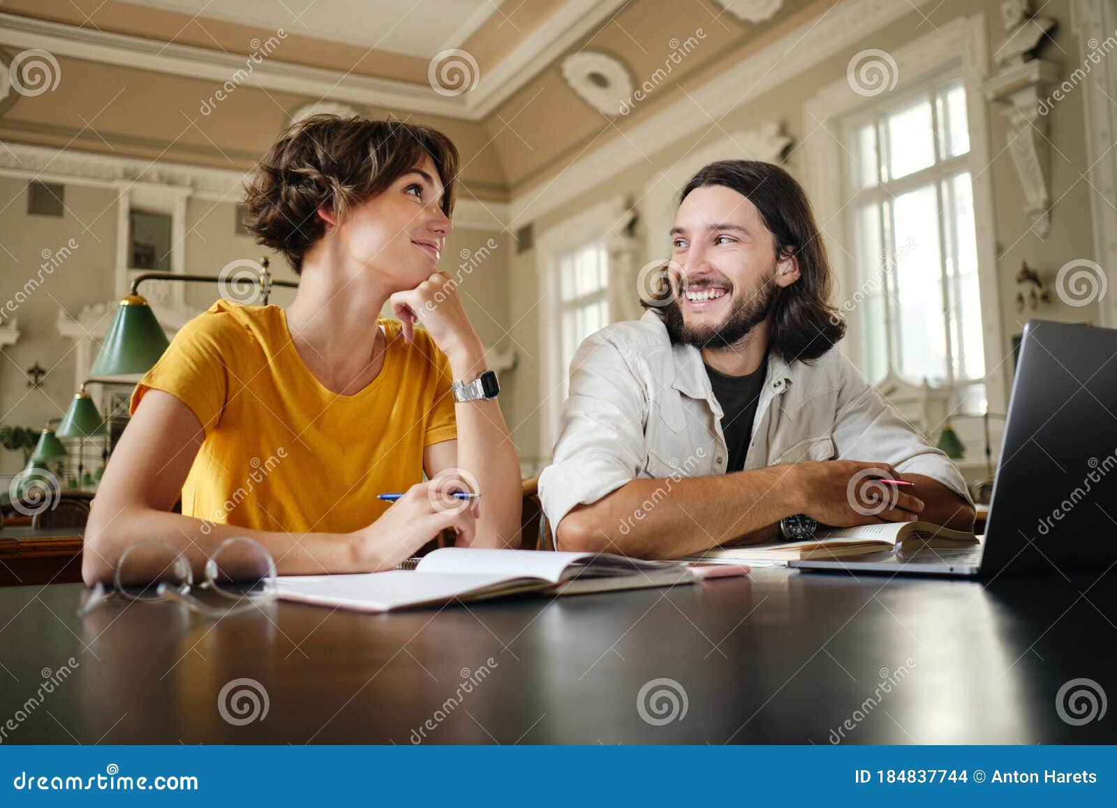Two Young Students Happily Working on Study Project with Laptop and ...