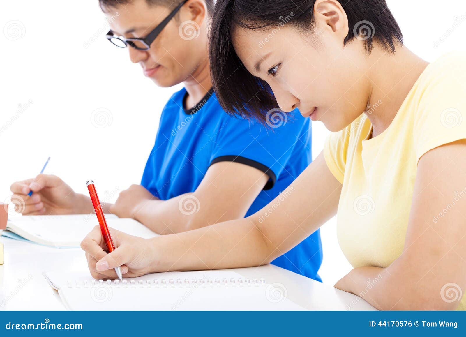 Two Young Students Learning Together in Classroom Stock Photo - Image ...