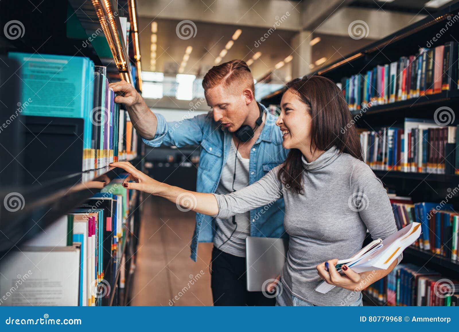 Two Young Students at Library Book Shelf Stock Photo - Image of books ...