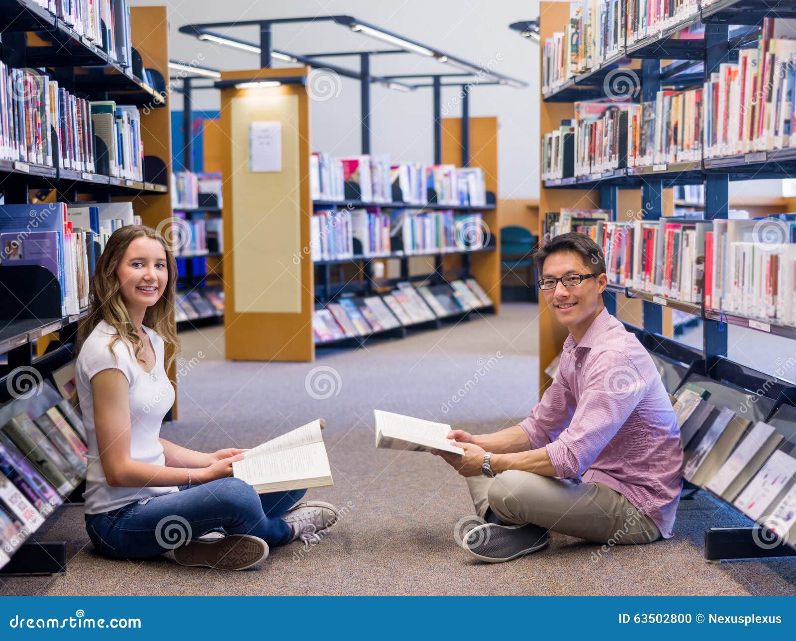 Two Young Students at the Library Stock Photo - Image of campus, read ...