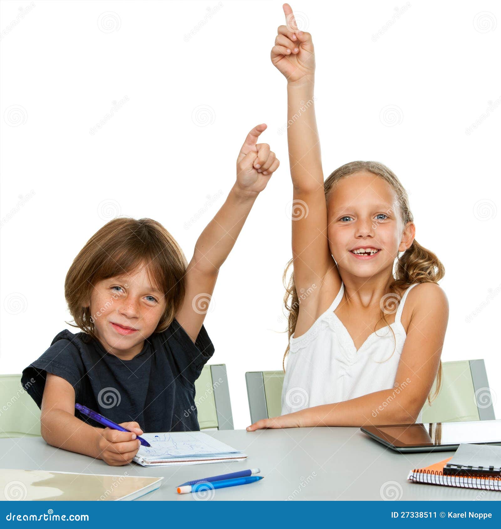 Two Young Students Raising Hands at Desk. Stock Image - Image of ...