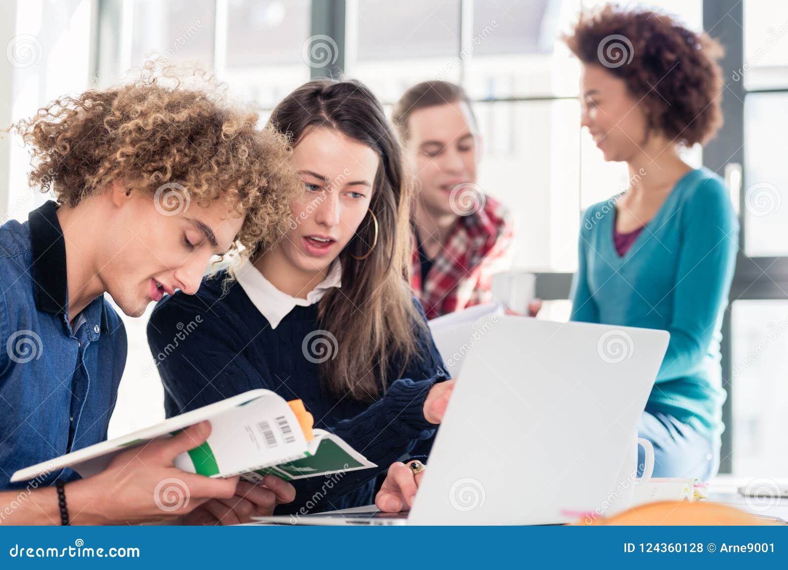 Two Young Students Searching for an Answer To Their Question Stock ...