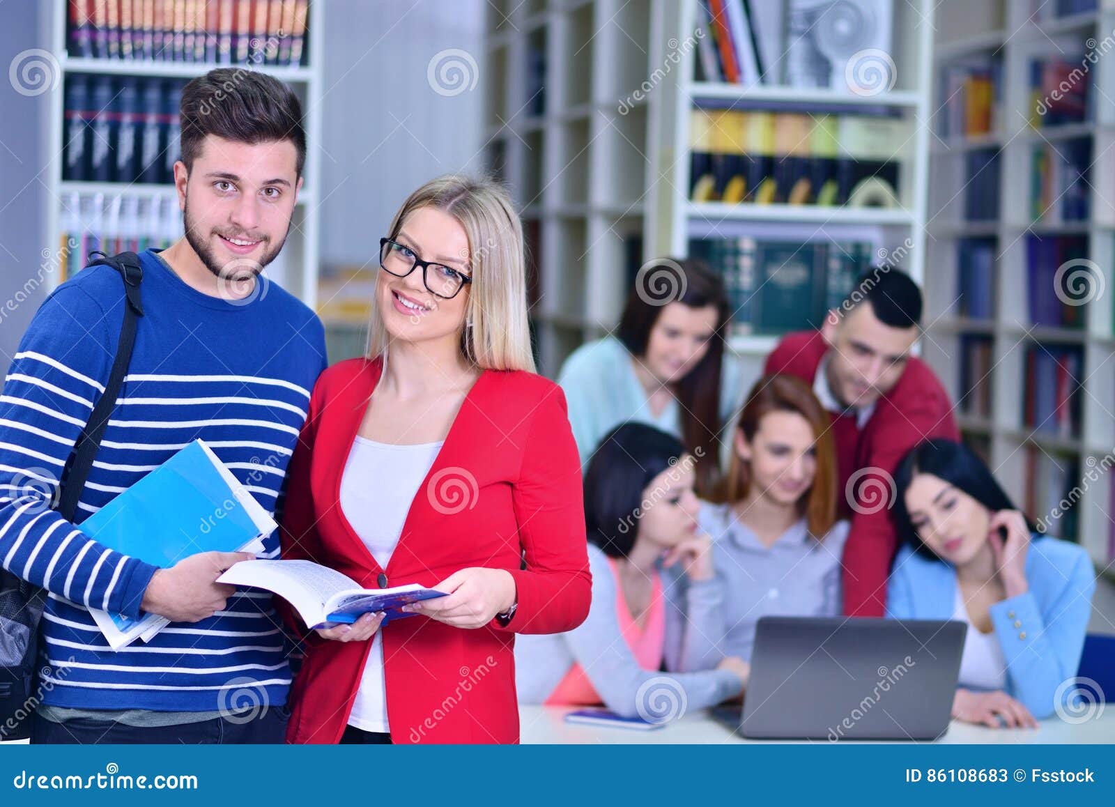Two Young Students Working Together at the Library Stock Image - Image ...