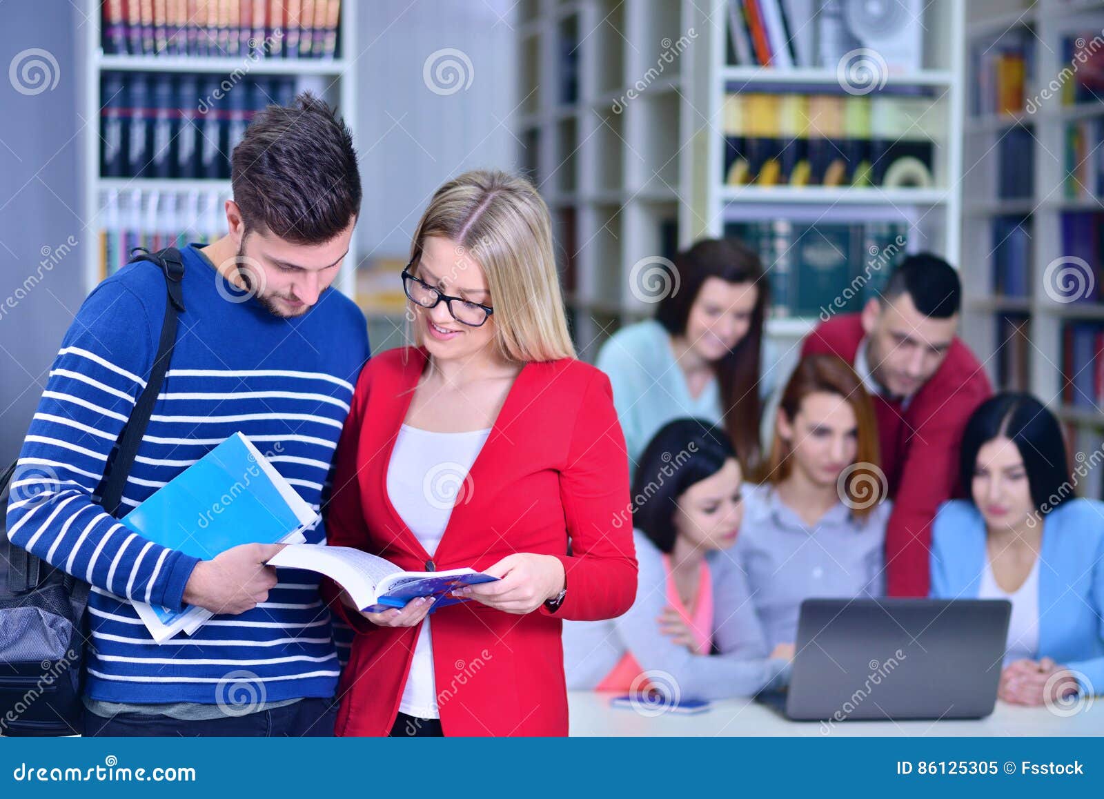 Two Young Students Working Together at the Library Stock Image - Image ...