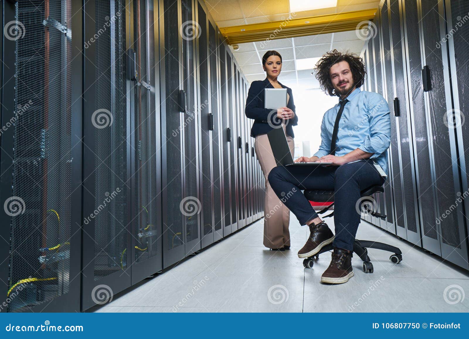 Two Young Technicans Working Stock Photo - Image of firewall, center ...