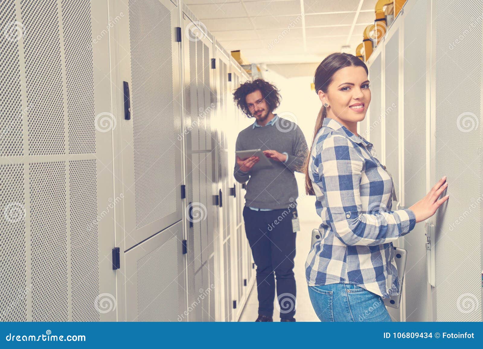 Two Young Technicans Working Stock Photo - Image of firewall, computer ...