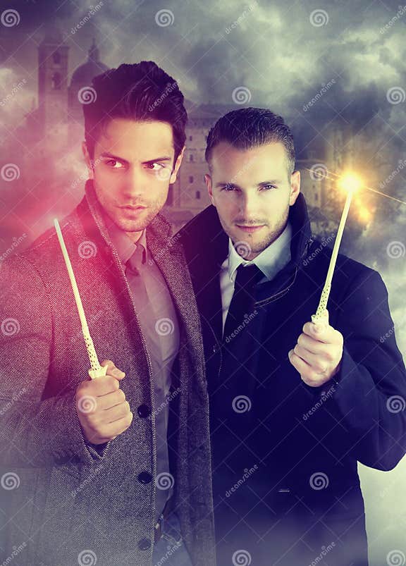 Two Young Wizards Holding a Magic Wand Stock Image - Image of wand ...
