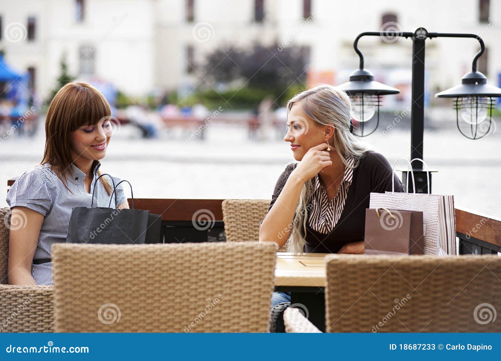 Two young woman chatting stock image. Image of beverage - 18687233