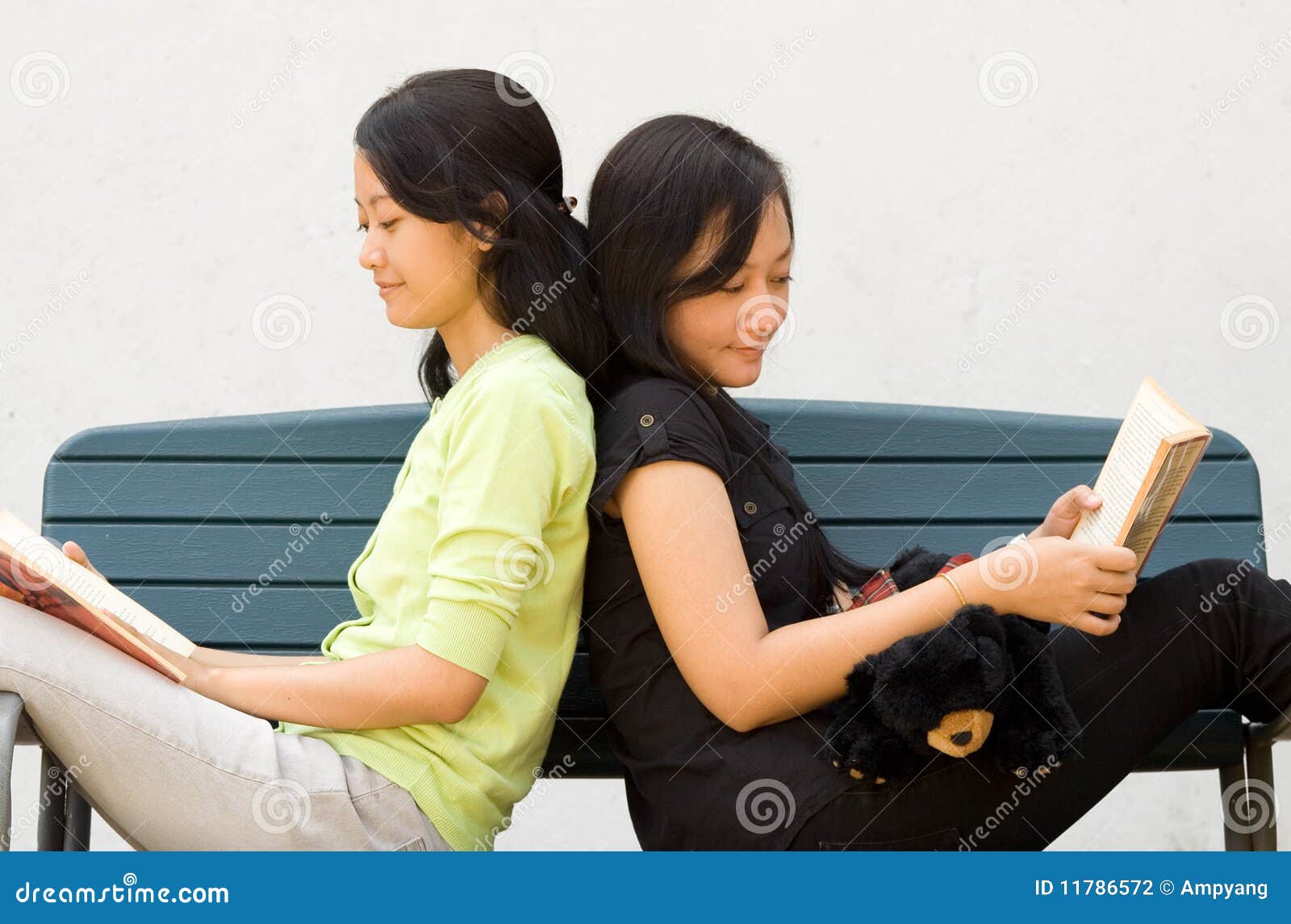 Two Young Woman Enjoy Reading Stock Photo - Image of sisters, girl ...