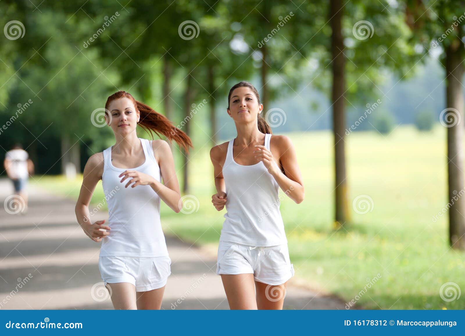 Two Young Woman Running in a Park Stock Photo - Image of running ...