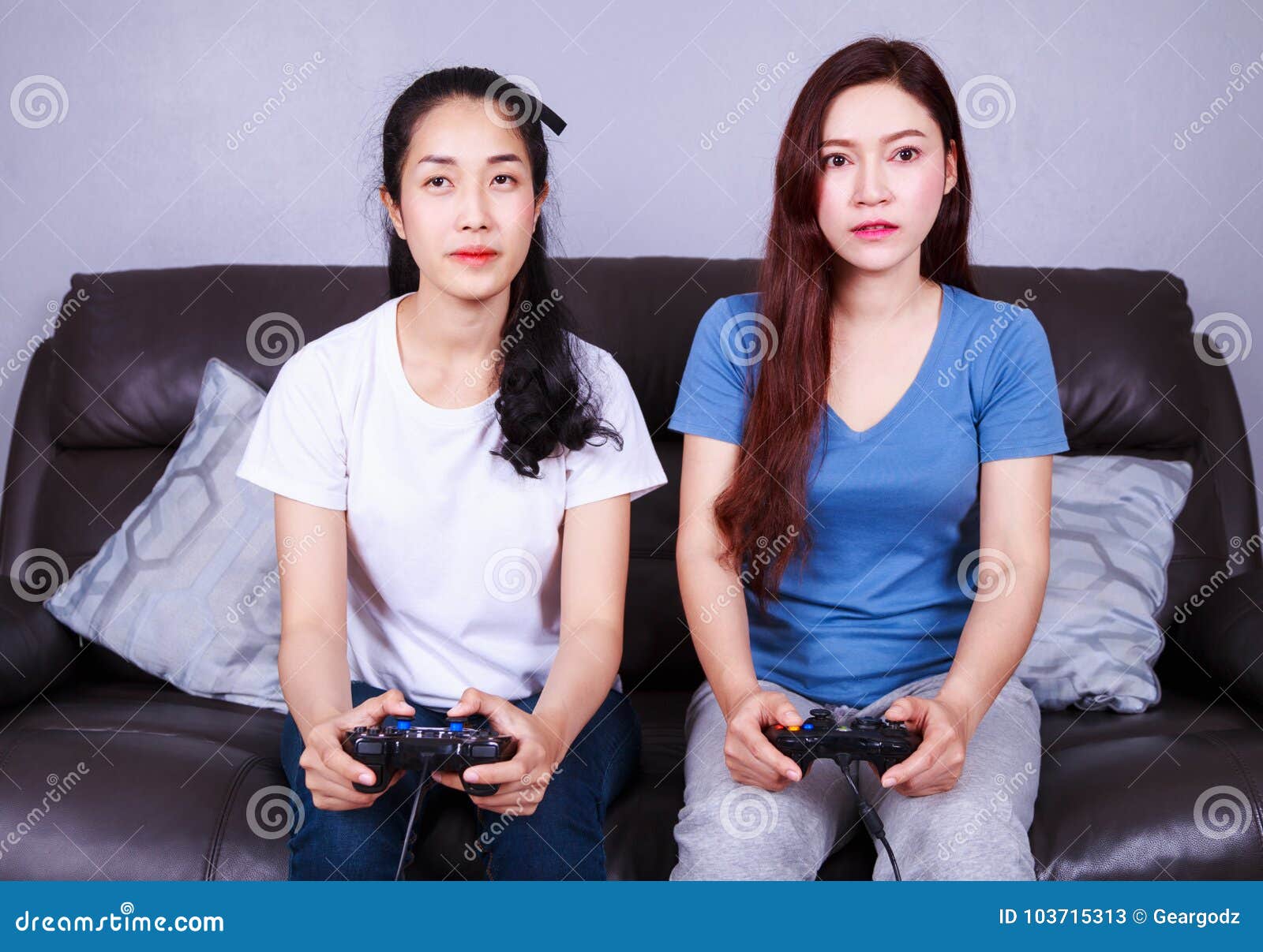 Two Young Woman Using Joystick Controller Playing Video Game on Stock ...