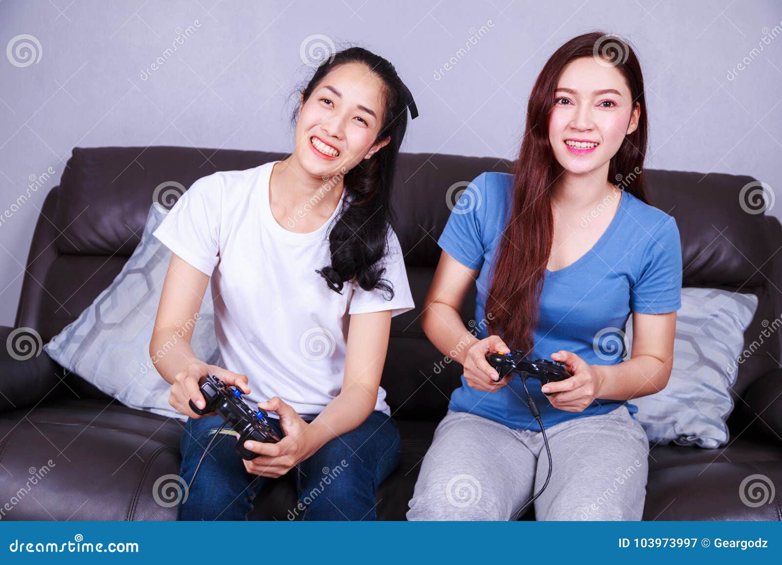 Two Young Woman Using Joystick Controller Playing Video Game on Stock ...