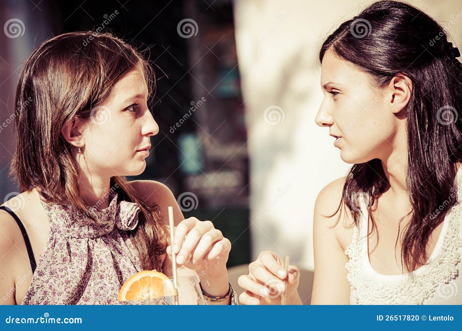 Two Young Women Cheering with Cold Drinks Stock Photo - Image of people ...