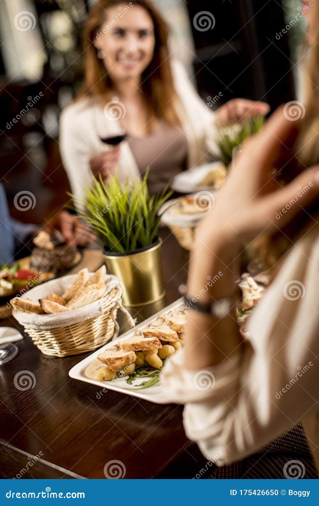 Two Young Women at a Dinner in a Restaurant Stock Photo - Image of ...