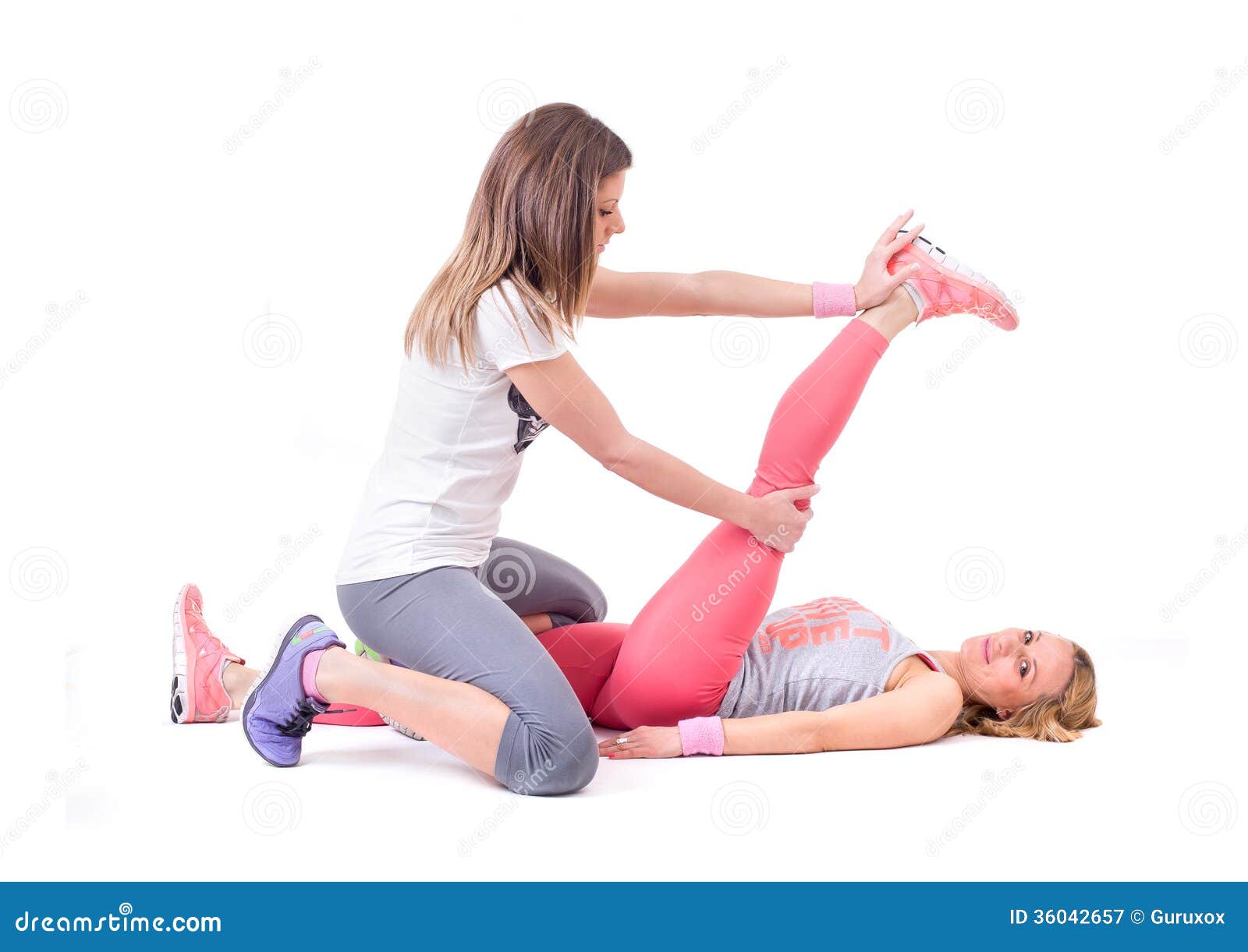 Two Young Women Doing Yoga Stretching Exercises Stock Image - Image of ...