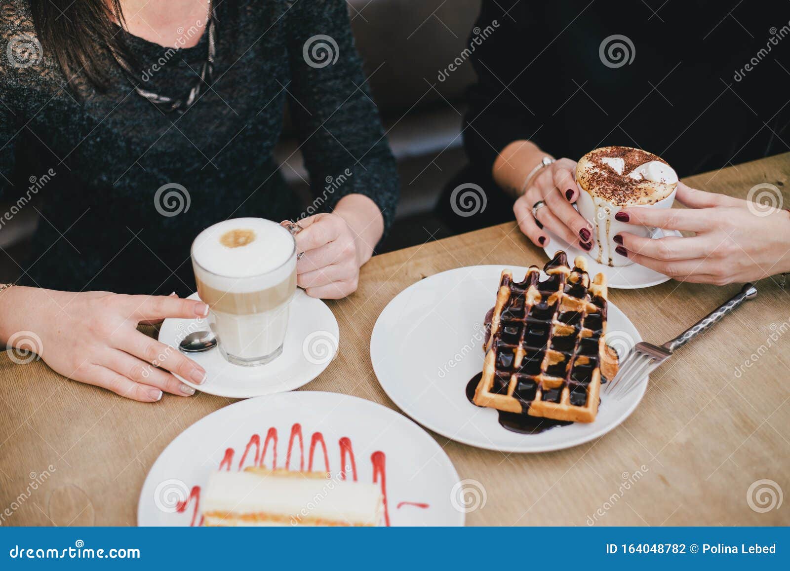 Two Young Women Drinking Coffee Together in a Cafe Stock Photo - Image ...