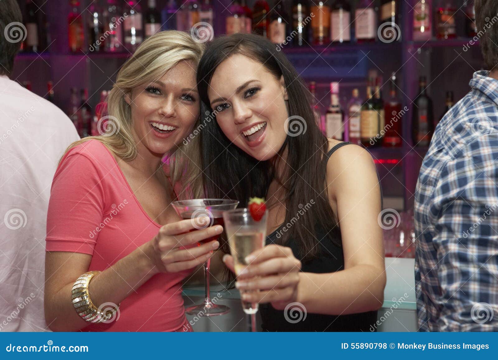 Two Young Women Enjoying Drinks in Bar Stock Photo - Image of ...