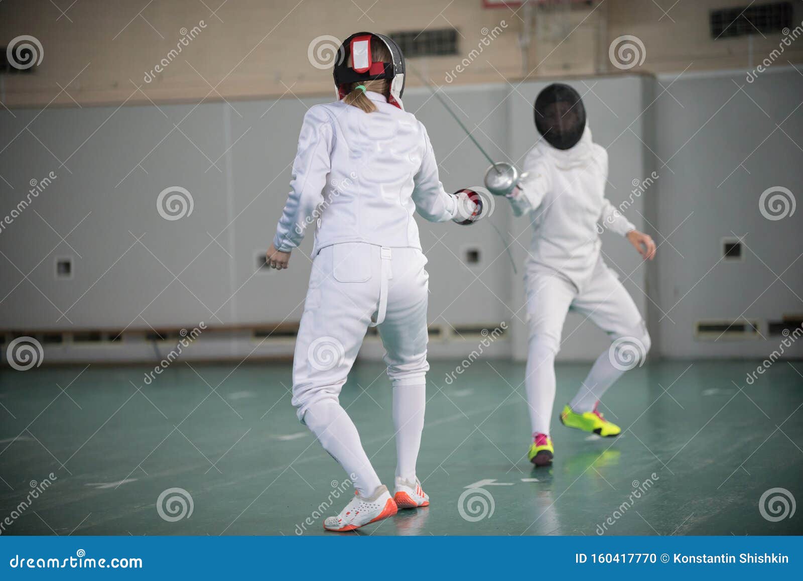 Two Young Women Fencers Having a Training - Standing in Attack Pose ...