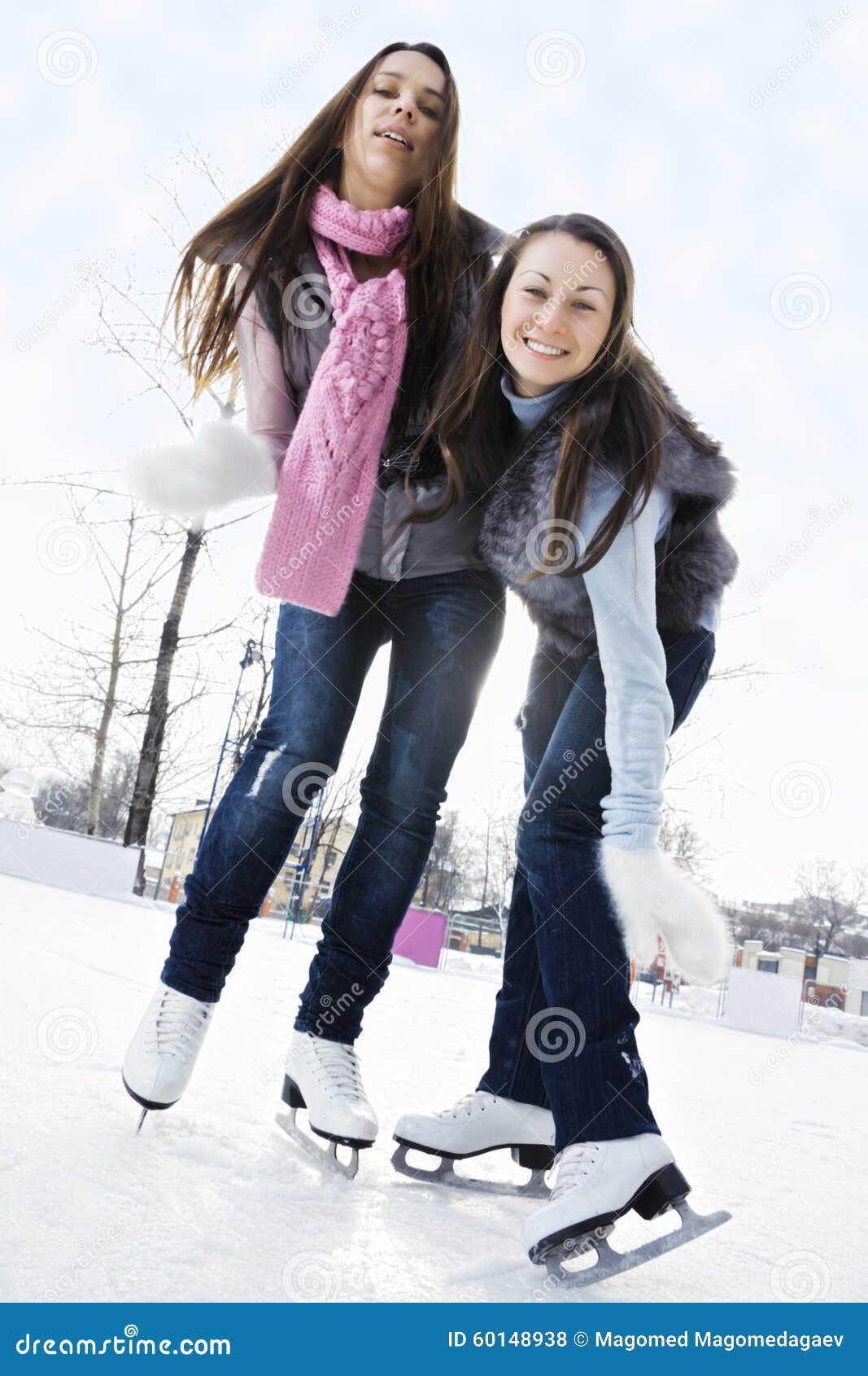 Two Young Women on Ice Rink Stock Photo - Image of cold, skating: 60148938