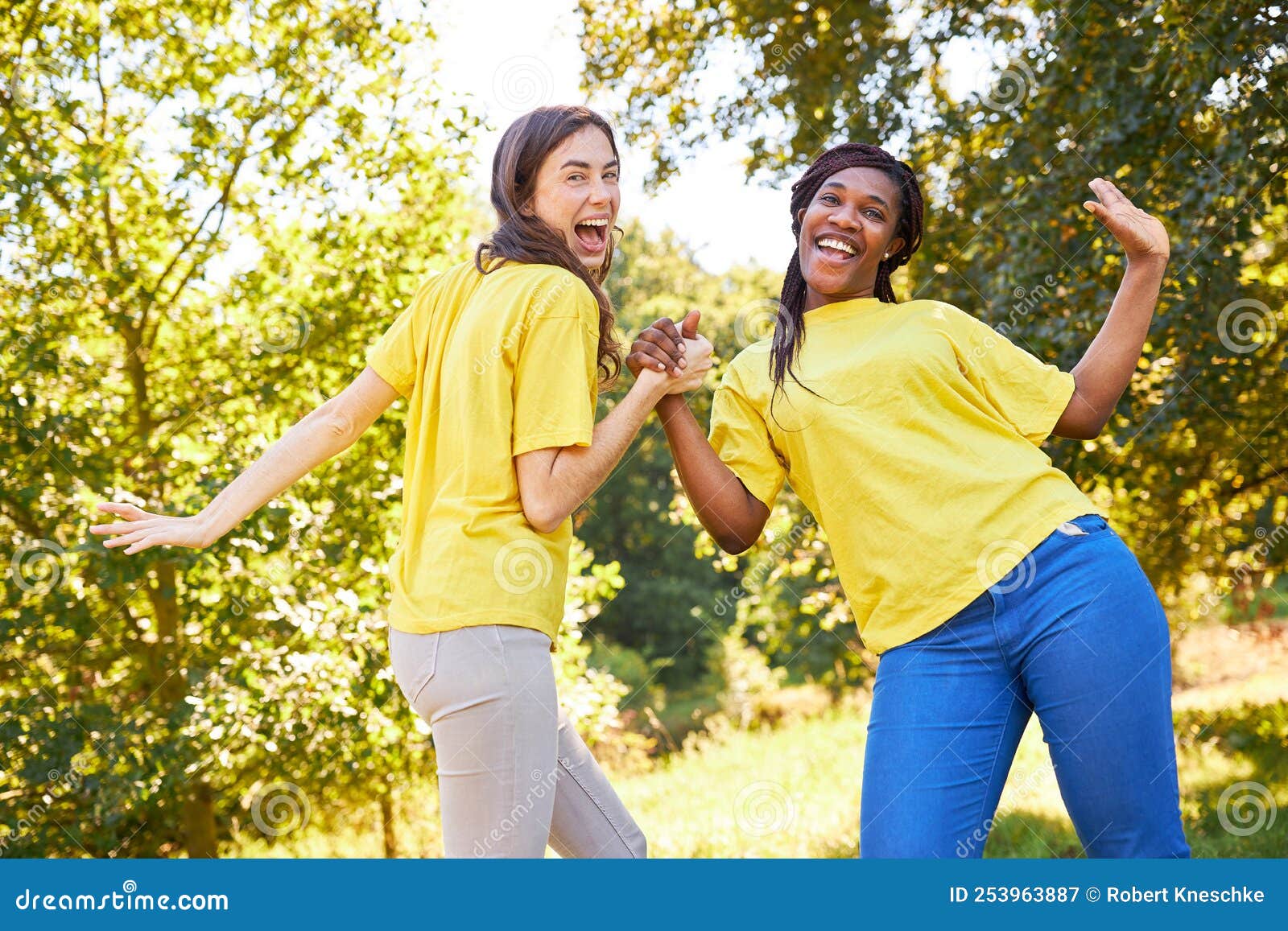 Two Young Women Laugh and Dance Together Stock Image - Image of sport ...